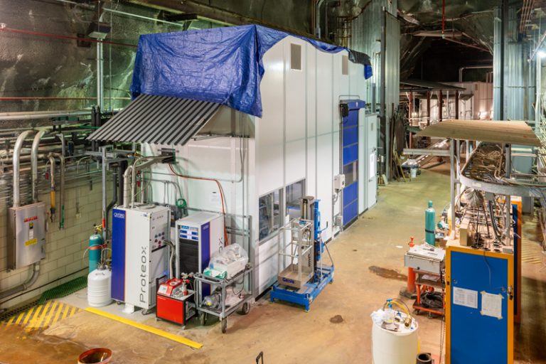 QUIET: a place to study qubits shielded from the effects of cosmic rays